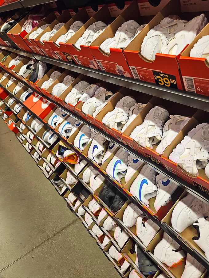 Sneaker heaven stretches before you—rows of pristine athletic footwear just waiting to transform you into the person who actually uses that gym membership.