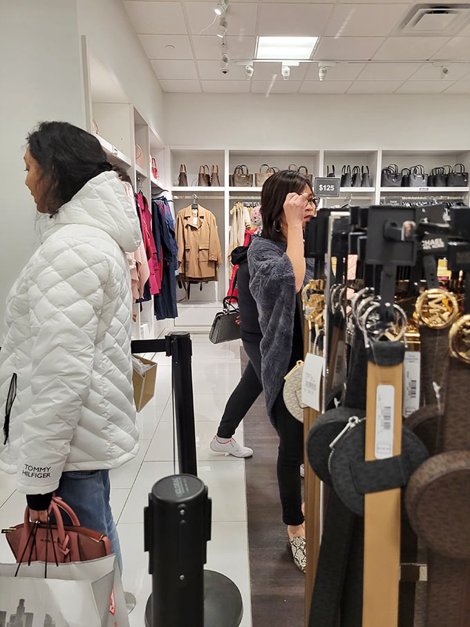 Fashion hunters in their natural habitat, stalking the perfect designer deal with the focus of wildlife photographers waiting for a rare bird sighting.