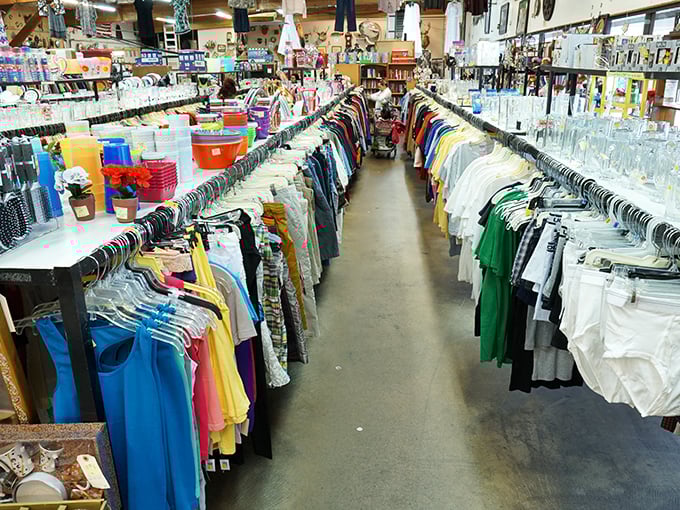 The thrill of the hunt in action—shoppers navigating the well-organized clothing aisles where yesterday's styles become tomorrow's vintage finds.