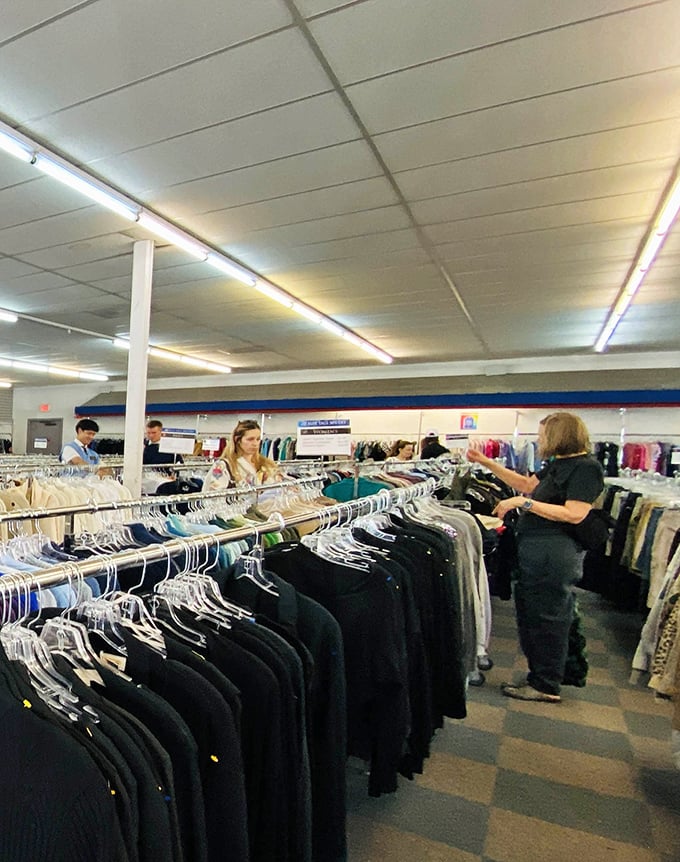 Serious thrifters scan the racks with laser focus—this isn't amateur hour, folks, this is Olympic-level bargain hunting at its finest.
