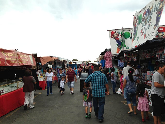 Families make their way through the marketplace maze. The real entertainment is watching kids discover their first swap meet treasures.