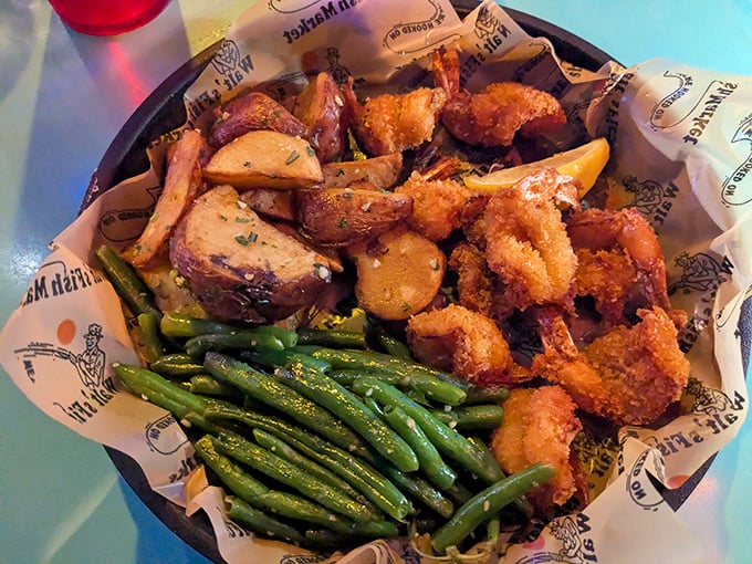 A basket of fried shrimp and potatoes that says, "Diet? What diet? You're in Florida—this is therapy."