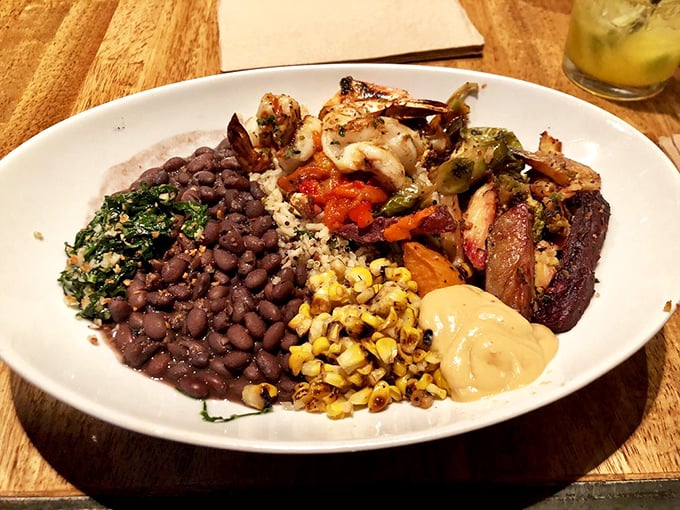 A Brazilian feast plate that's like a flavor passport—black beans, greens, and perfectly grilled meat create harmony that would make Sergio Mendes proud.