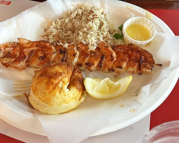 Simplicity at its most delicious – a perfectly grilled shrimp skewer that proves sometimes the best seasoning is just fire, smoke, and the ocean's natural bounty.