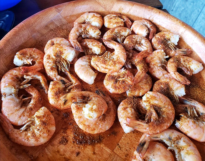 These blackened shrimp aren't just cooked, they're transformed – spice-kissed treasures that would make Neptune himself order seconds.