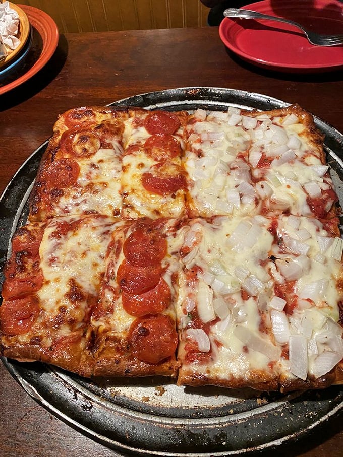 Behold the legendary Sicilian pizza that's worth crossing county lines for—half pepperoni, half onion, and 100% the reason elastic waistbands were invented.