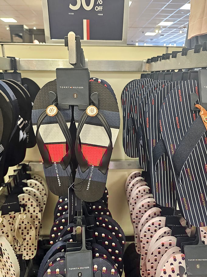 Tommy Hilfiger flip-flops await desert-weary feet—because nothing says "I'm on vacation" like patriotic footwear with 50% off the retail price.
