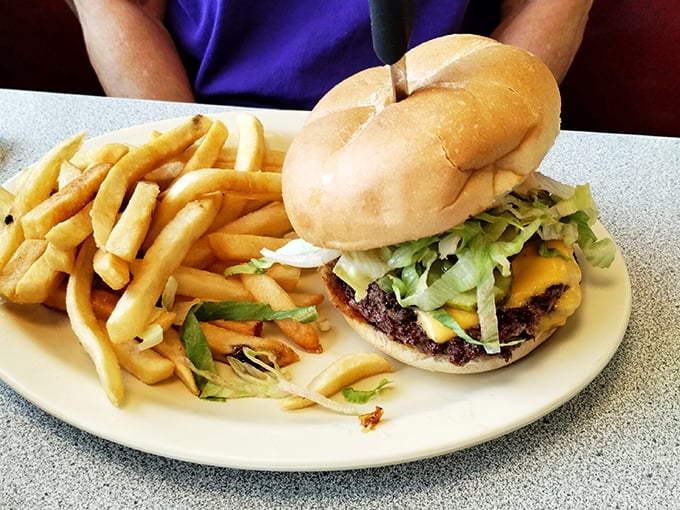 A proper diner burger doesn't need fancy toppings or a PR team—just quality beef, melty cheese, fresh veggies, and a bun that knows its supporting role.