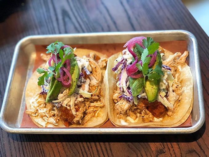 These aren't your average tacos – they're smoky masterpieces dressed in fresh cilantro, pickled onions, and pure California creativity.