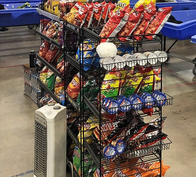 Even snacks get the bin treatment! This rack offers sustenance for marathon shoppers who know that treasure hunting requires proper fueling.