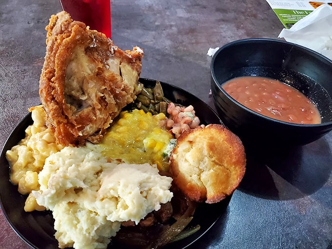 This isn't a plate—it's a Southern symphony. Crispy fried chicken, creamy mac and cheese, and a cornbread muffin that would make your grandmother both proud and jealous.