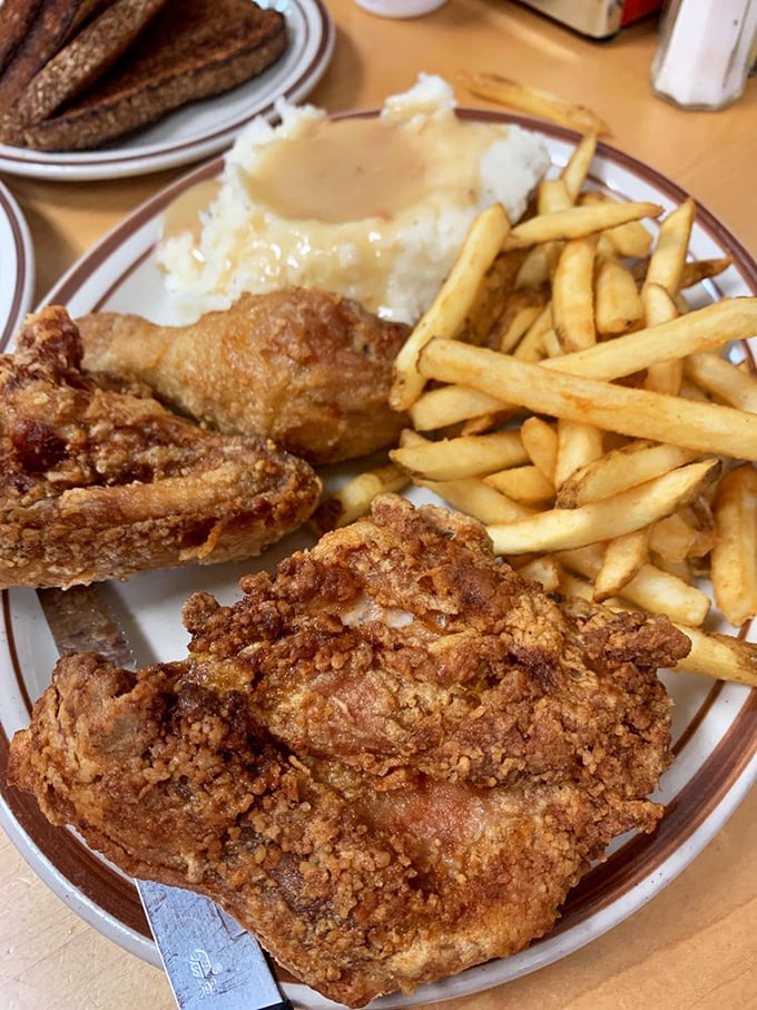 Southern fried chicken that would make your grandmother nod in approval, paired with mashed potatoes drowning in gravy – comfort food nirvana.