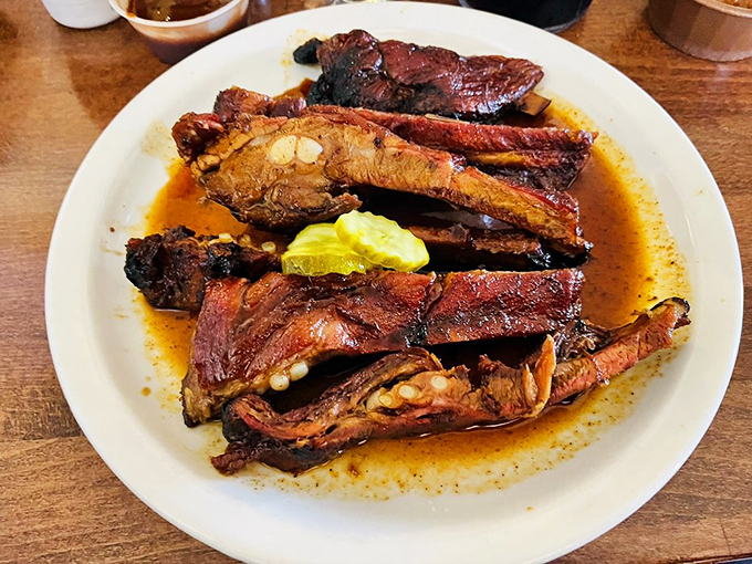 These ribs don't just fall off the bone—they practically leap into your mouth. The telltale smoke ring is like nature's seal of approval.