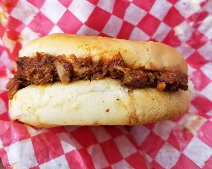 The kind of sandwich that makes you forget your table manners. Notice there's no need for fancy garnishes when the meat speaks for itself.