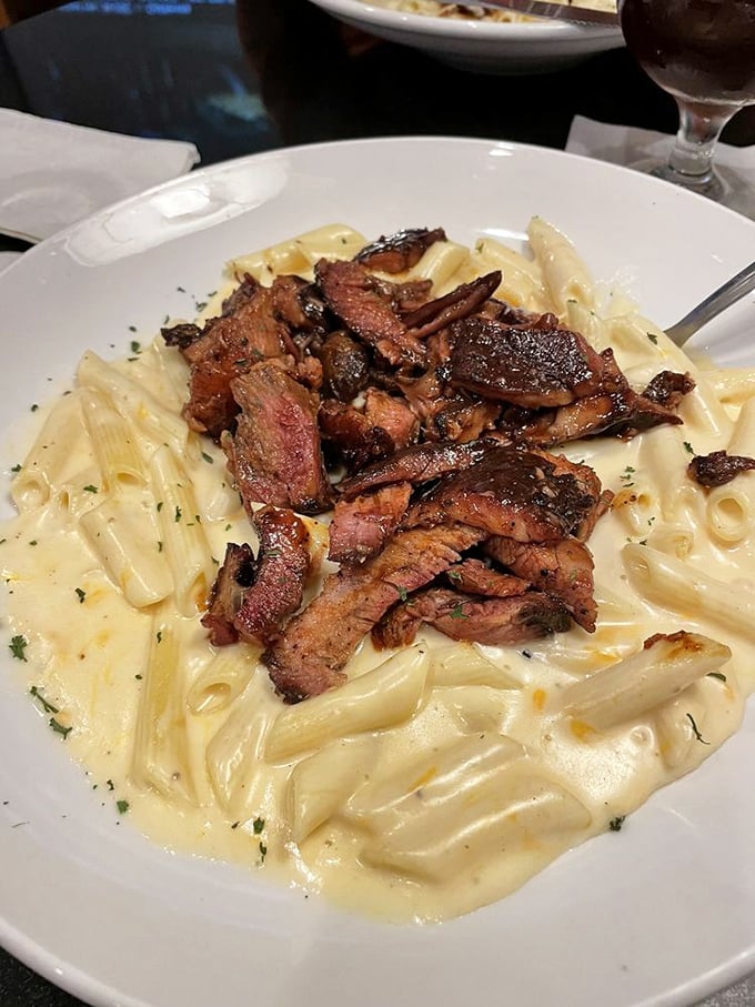 This isn't just pasta with meat—it's a love story between tender steak and creamy mac & cheese that would make Shakespeare weep.