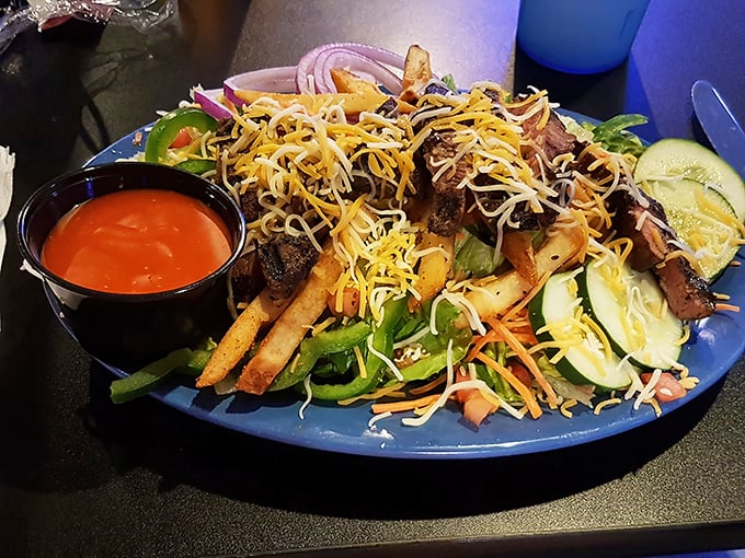 Not just a side thought—this steak salad means business with perfectly cooked meat, crisp veggies, and fries that crashed the healthy party.