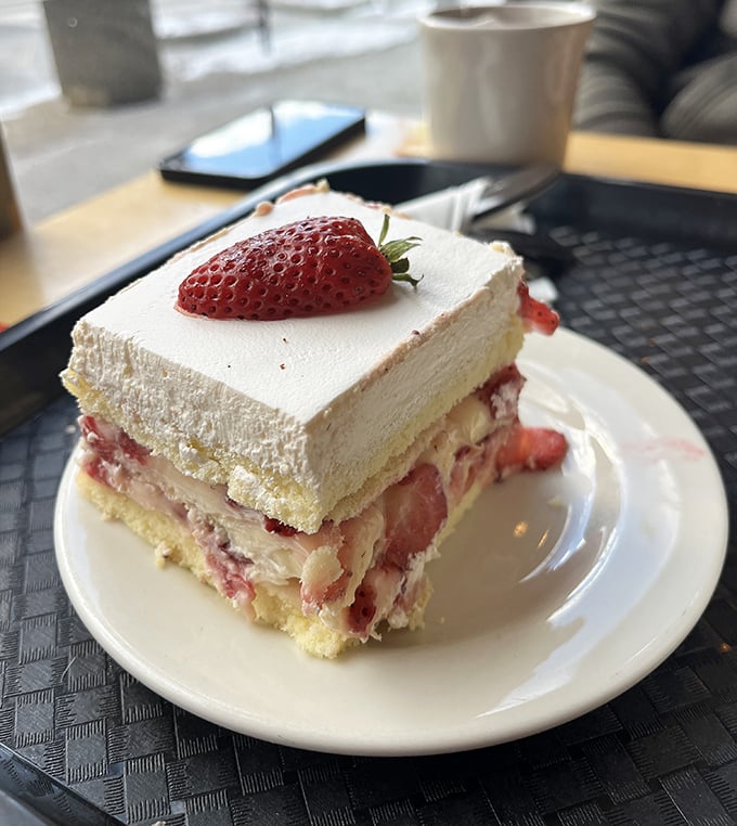 This strawberry cake doesn't just have layers – it has chapters in a delicious story. The fresh berry garnish is like nature's exclamation point.