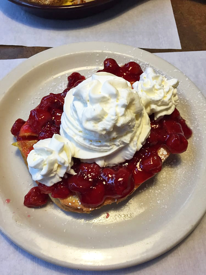 This stuffed French toast with strawberries and whipped cream isn't just breakfast—it's dessert with permission. Morning indulgence at its finest.