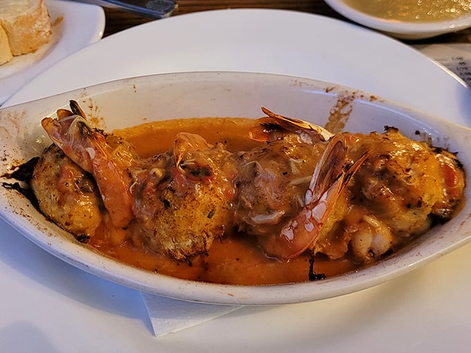 Jumbo shrimp nestled in a rich, savory sauce—proof that sometimes the most memorable seafood comes not from the ocean, but from a well-loved kitchen.
