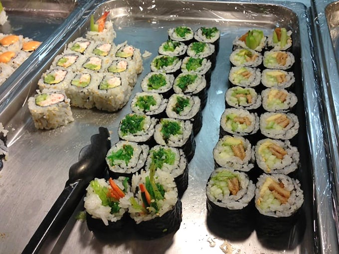 The sushi selection proves buffets can surprise you—fresh, colorful rolls lined up like soldiers ready for the delicious battle ahead.