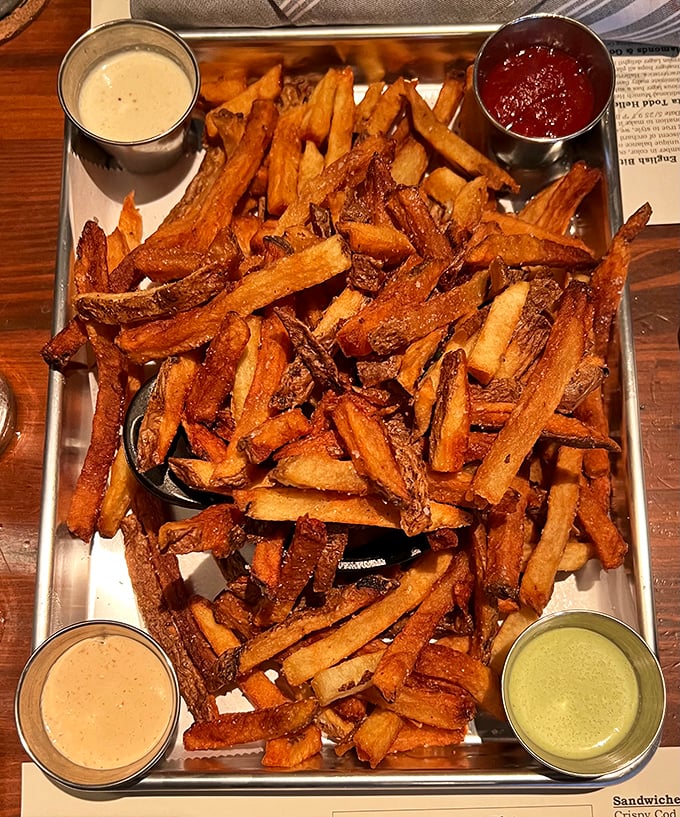 These aren't just fries—they're golden therapy sessions served with dipping sauces that should charge by the hour for their services.
