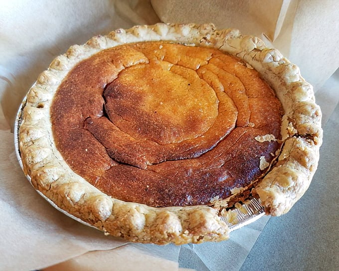 Not just any pie—a sweet potato masterpiece with a crust that whispers "homemade." The kind of dessert that makes you consider skipping the main course.