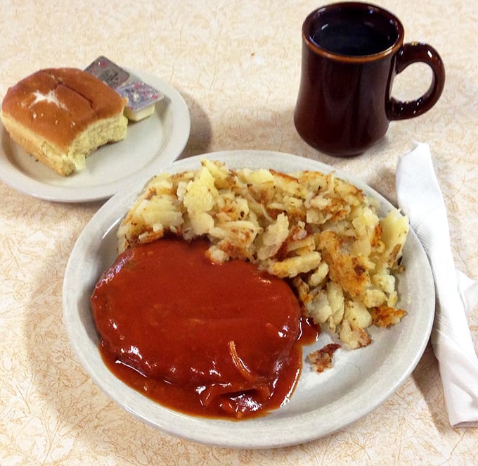 Swiss steak and hash browns – the kind of plate that makes you want to cancel your afternoon plans in favor of a well-deserved food nap.