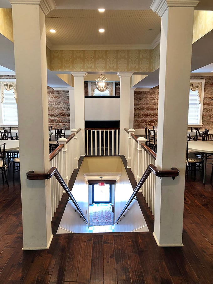 Grand staircases and exposed brick walls—this beautifully restored interior space whispers tales of Sandersville's past while welcoming visitors into its present.