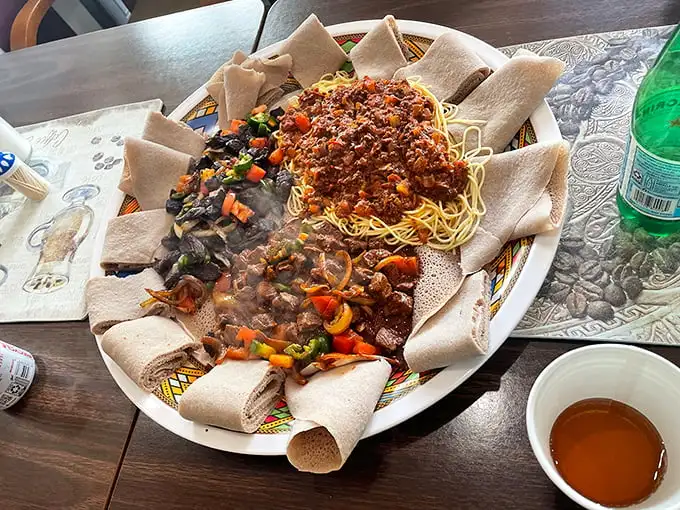 Spaghetti meets Ethiopian spices in this cultural crossroads of a dish, where Italy and East Africa create a delicious diplomatic agreement.