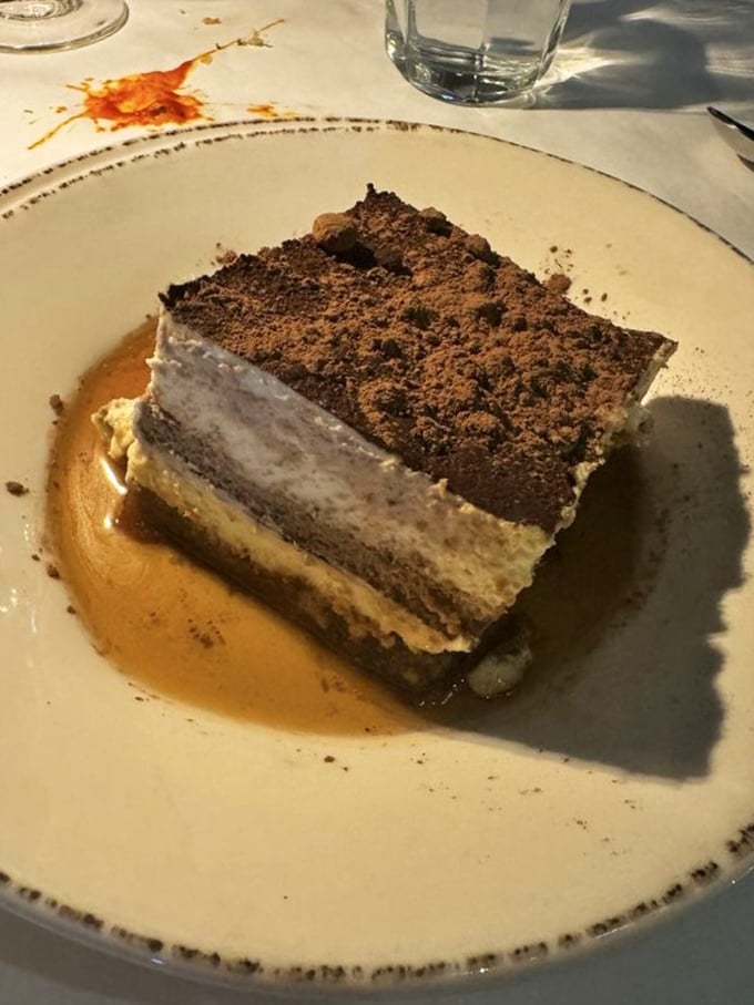 This tiramisu doesn't just satisfy a sweet tooth – it's an archaeological dig through layers of coffee-soaked bliss and mascarpone clouds that rewards every spoonful.