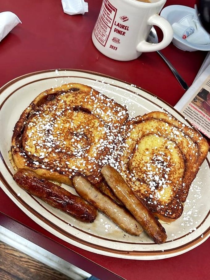 French toast that's dressed for success with a dusting of powdered sugar and sausage sidekicks standing guard against hunger pangs.