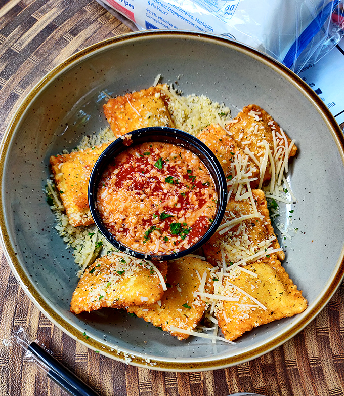 Golden-brown toasted ravioli surrounding a vibrant dipping sauce – Missouri's favorite appetizer dressed up for a night on the town.