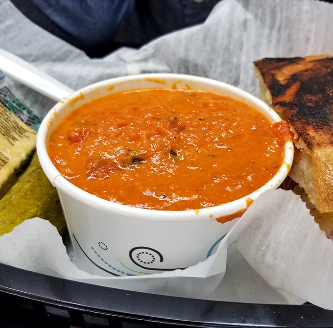 This isn't just tomato soup—it's liquid comfort in a cup, the perfect dance partner for whatever sandwich you've chosen as your lunch date.