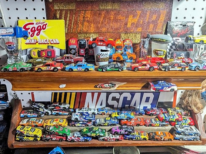 NASCAR miniatures lined up like colorful soldiers, waiting to race from a vendor's display straight into a collector's heart.