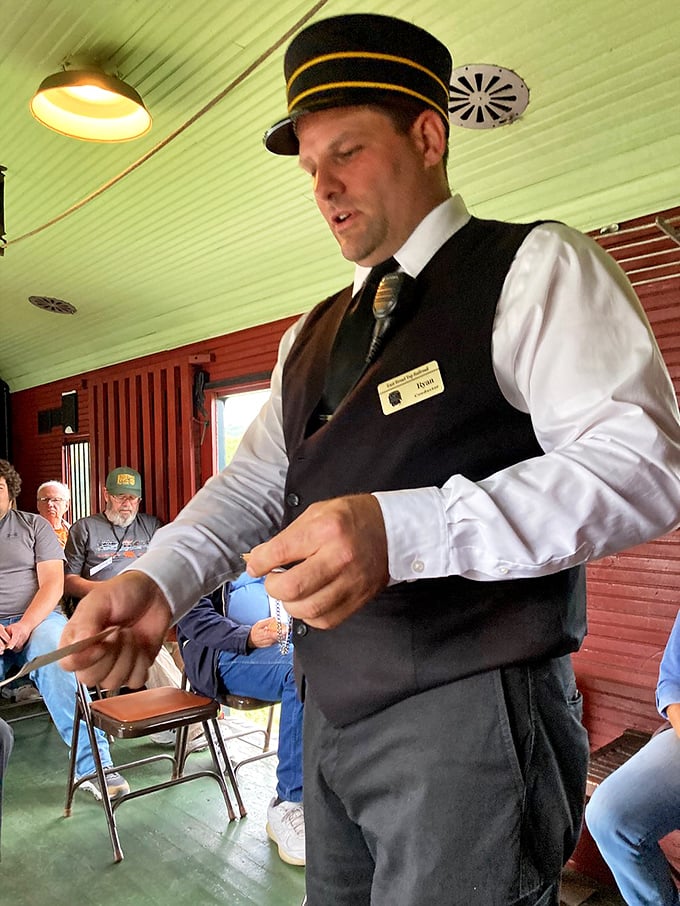 The conductor's uniform hasn't changed in a century—proof that some fashions, like steam locomotives, achieve timeless perfection.
