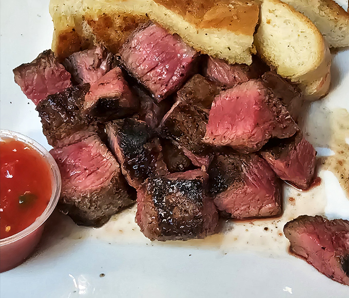 These tri-tip cubes aren't just steak—they're meaty little time machines to California's ranching heritage, served with grilled bread for sopping duties.