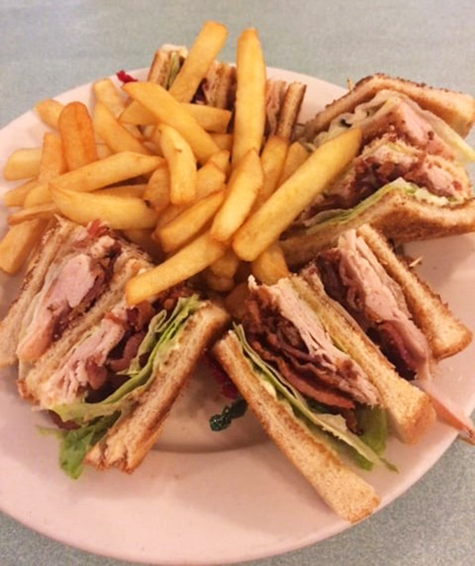 The club sandwich—architecture's greatest contribution to lunchtime. Stacked higher than Florida condo premiums and twice as satisfying.