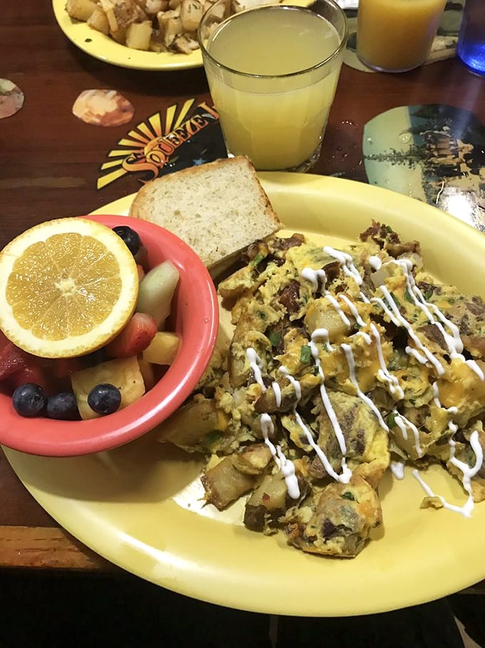 Scrambled eggs elevated to an art form—this twice-baked masterpiece with its drizzle of sauce proves breakfast doesn't have to be basic.