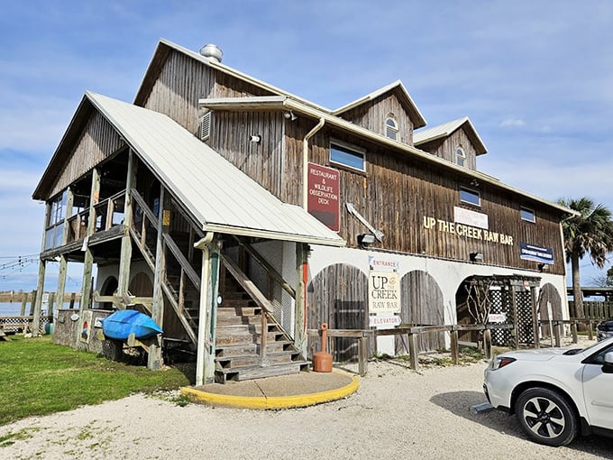 Up The Creek Raw Bar embodies rustic coastal charm with its weathered wood exterior – like a delicious secret only the locals were supposed to know about.