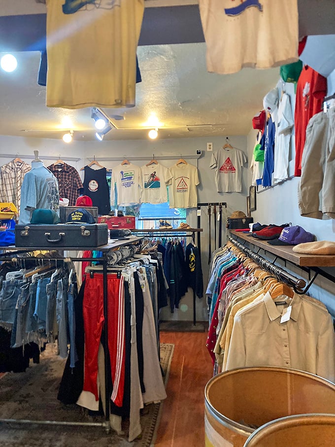 Vintage sports gear mingles with everyday classics in this room where track lighting spotlights treasures that previous owners mysteriously abandoned.