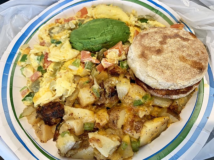 The Veggie Egg Scramble with avocado is California on a plate—sunshine-yellow eggs mingling with green peppers and those magical potatoes.
