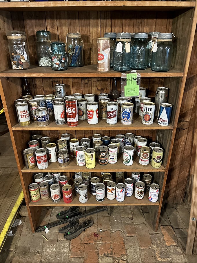 Beer cans that once quenched America's thirst now satisfy our nostalgia, stacked like a fizzy timeline of graphic design evolution.