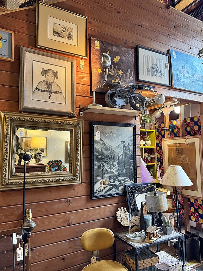 The art wall transforms wooden paneling into a gallery experience – framed portraits and landscapes waiting to grace your stairwell.