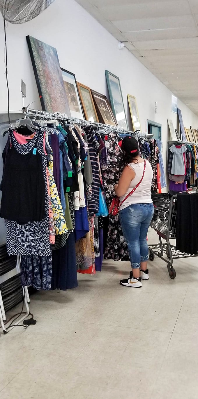 The art of the hunt in action. Those framed pieces above the clothing racks might be someone's next conversation starter.