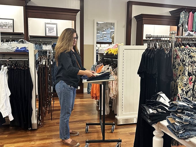 A shopper contemplates life's important questions: which jeans actually fit and will anyone notice they were 60% off retail?