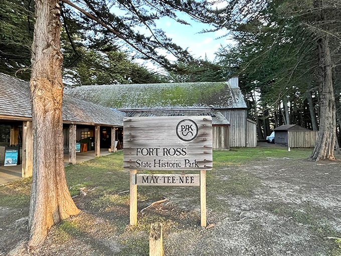 "MAY-TEE-NEE" welcomes visitors to Fort Ross's rustic visitor center, where California's Russian chapter begins to unfold beneath towering redwoods.