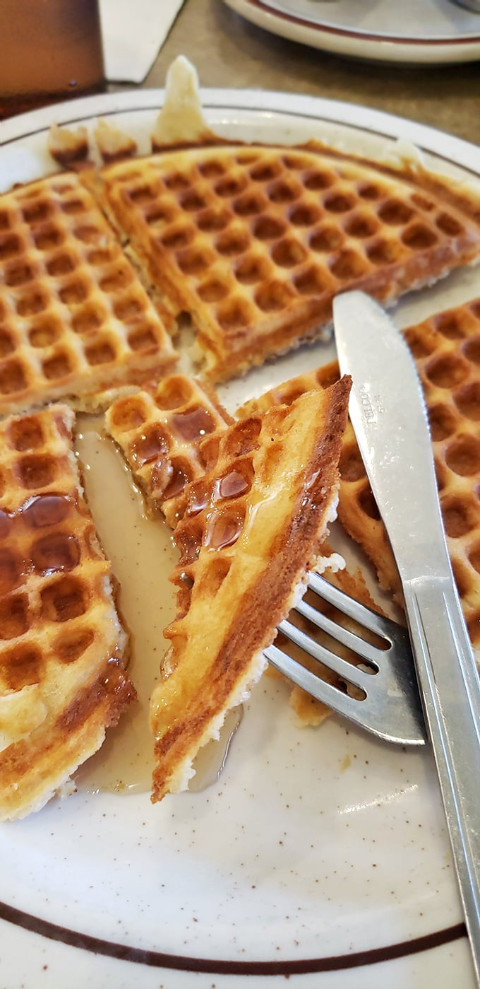 Waffles with perfect grid precision that would make architects jealous, creating little pools for maple syrup to skinny-dip in.