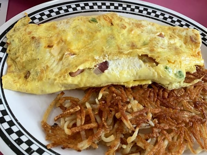 This Western omelet doesn't just contain ham and peppers—it showcases them, alongside hash browns crisped to golden perfection.