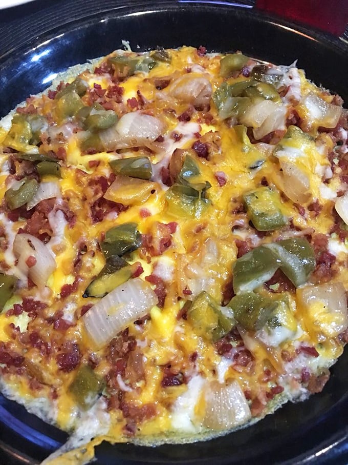 The Western omelet arrives looking like a cheese-covered landscape of morning delights. Those green peppers and onions aren't just toppings—they're flavor ambassadors.