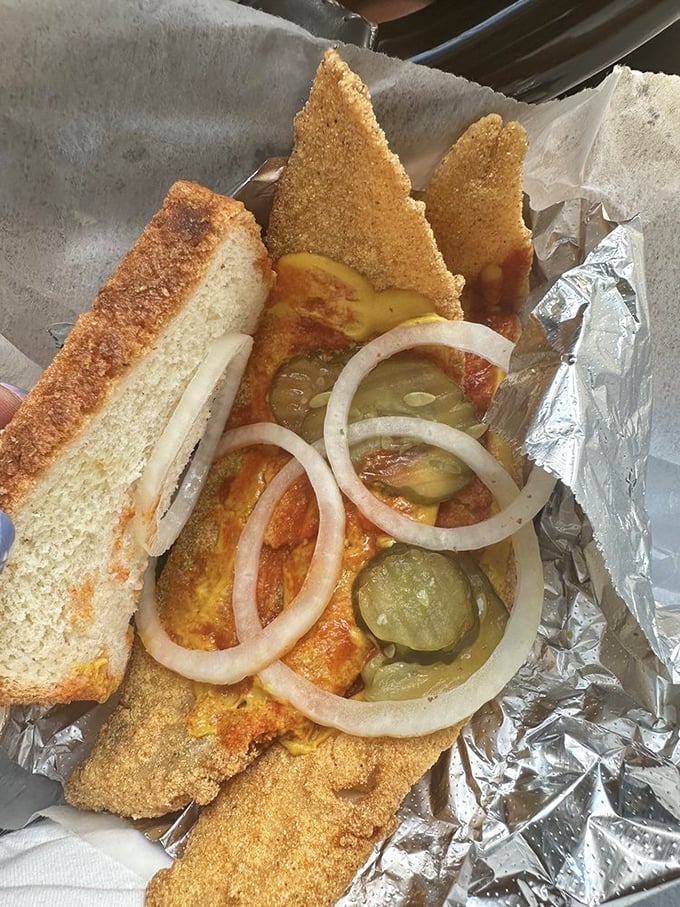 The legendary whiting sandwich in all its glory—crispy fish, soft bread, and that perfect combination of mustard, pickles, and onions that changes lives.